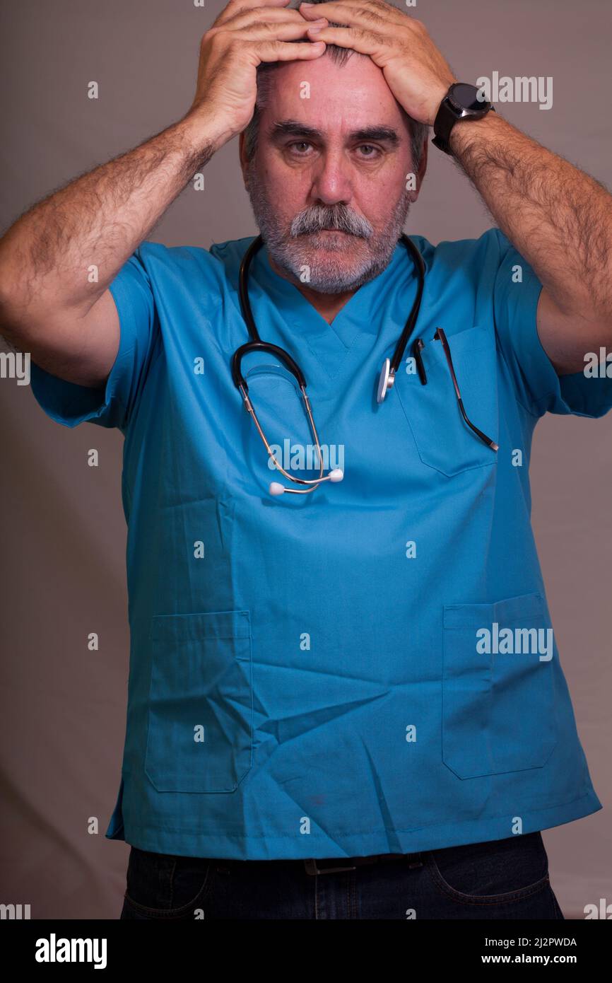 doctor with his hands on his head, bad news, exhaustion, stress Stock ...