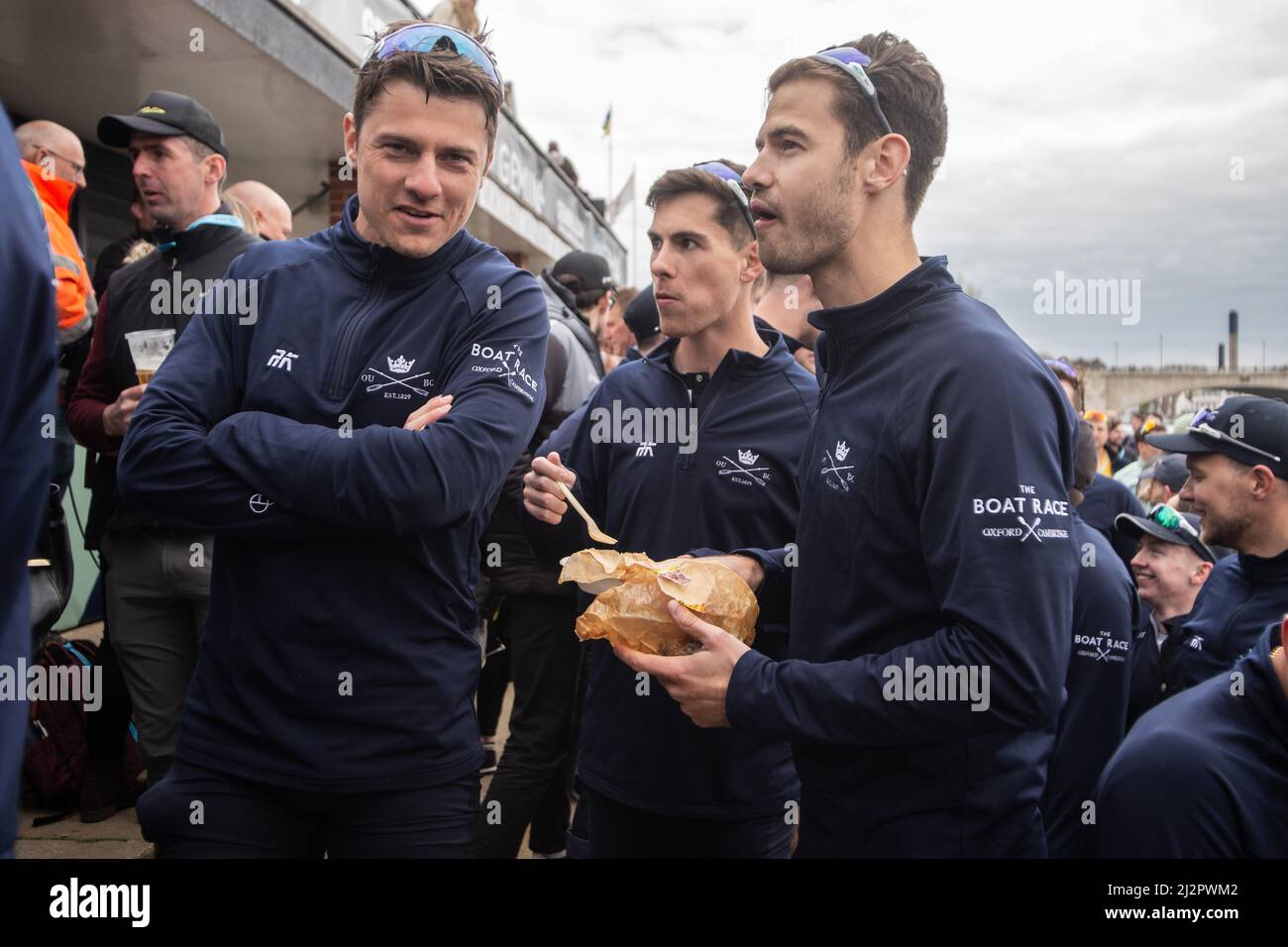 London, UK. 3rd Apr, 2022. Victorious crew members enjoy a post-race ...