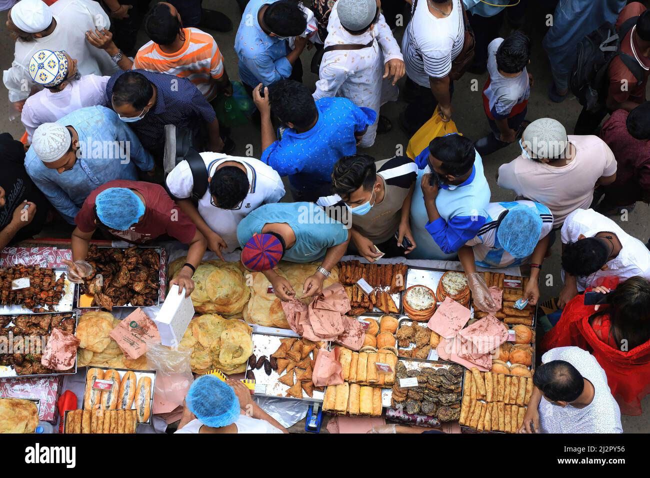 Street food vendors sell food and other iftar items during the first ...