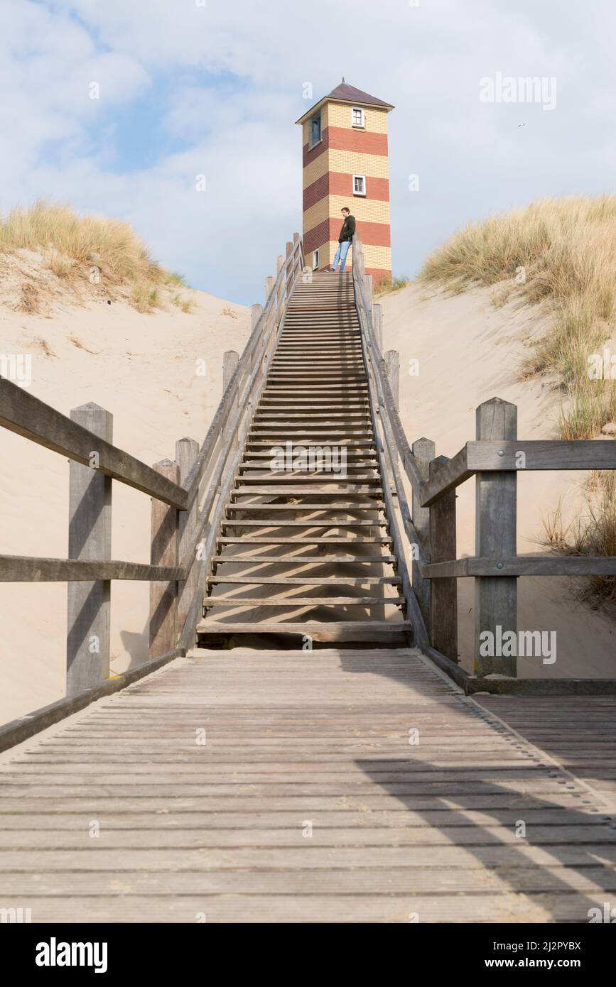 Wooden stairs leading to one of the two lighthouses of Kaapduinen in ...