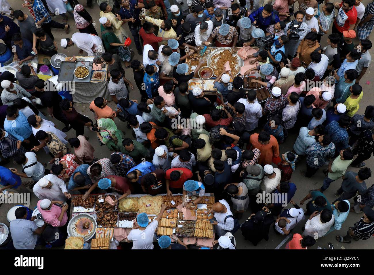 Street food vendors sell food and other iftar items during the first ...