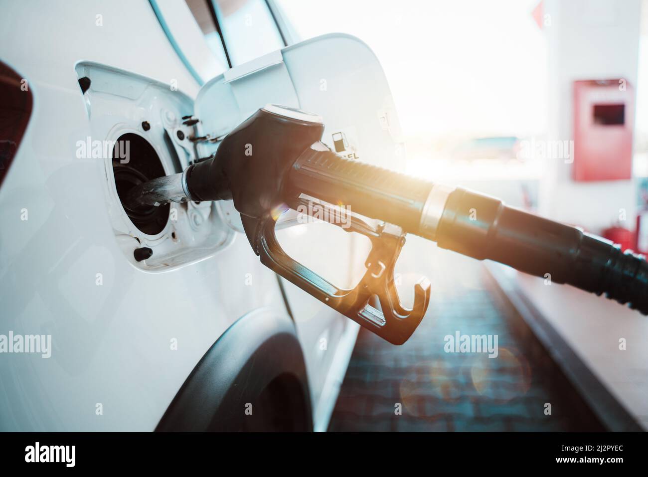 Fuel pump fill a tank of a car in a station Stock Photo - Alamy