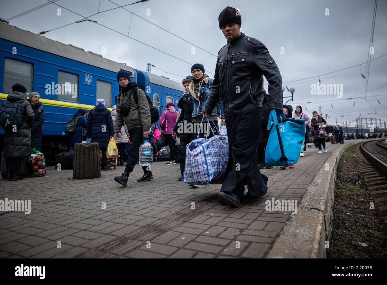 LVIV, UKRAINE - APR 02, 2022: War in Ukraine. Refugees women, children ...
