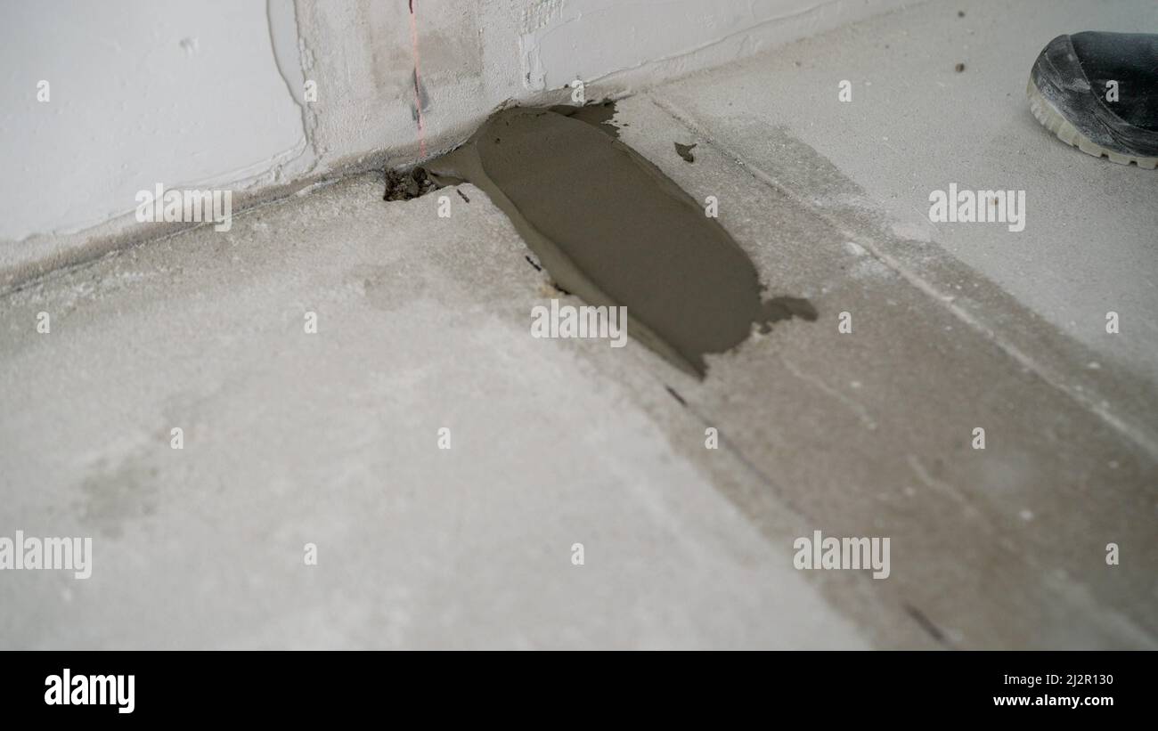 Application of adhesive solution on the concrete floor for aerated ...