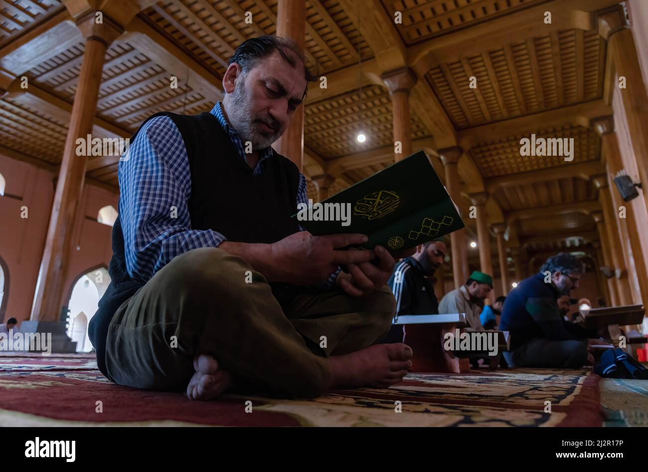 Kashmiri Muslims read Islamic holy book Quran inside Jamia Masjid on ...