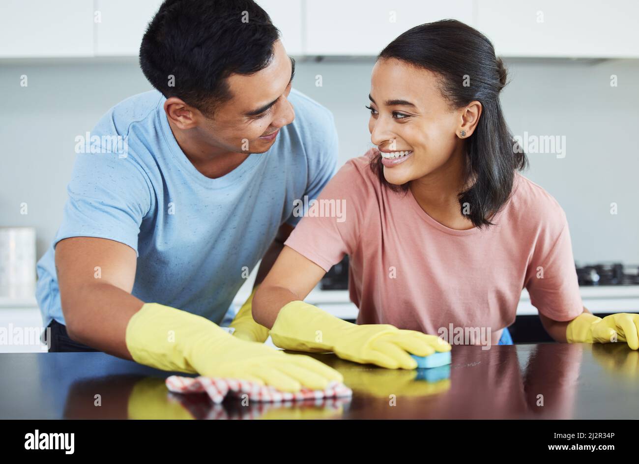 Ethnic couple cleaning house hi-res stock photography and images - Alamy