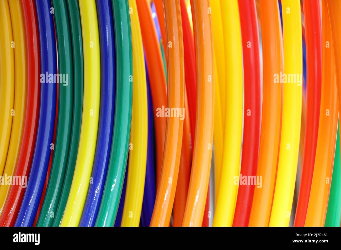 Colorful hoops for fitness in sports store. Background with rainbow ...