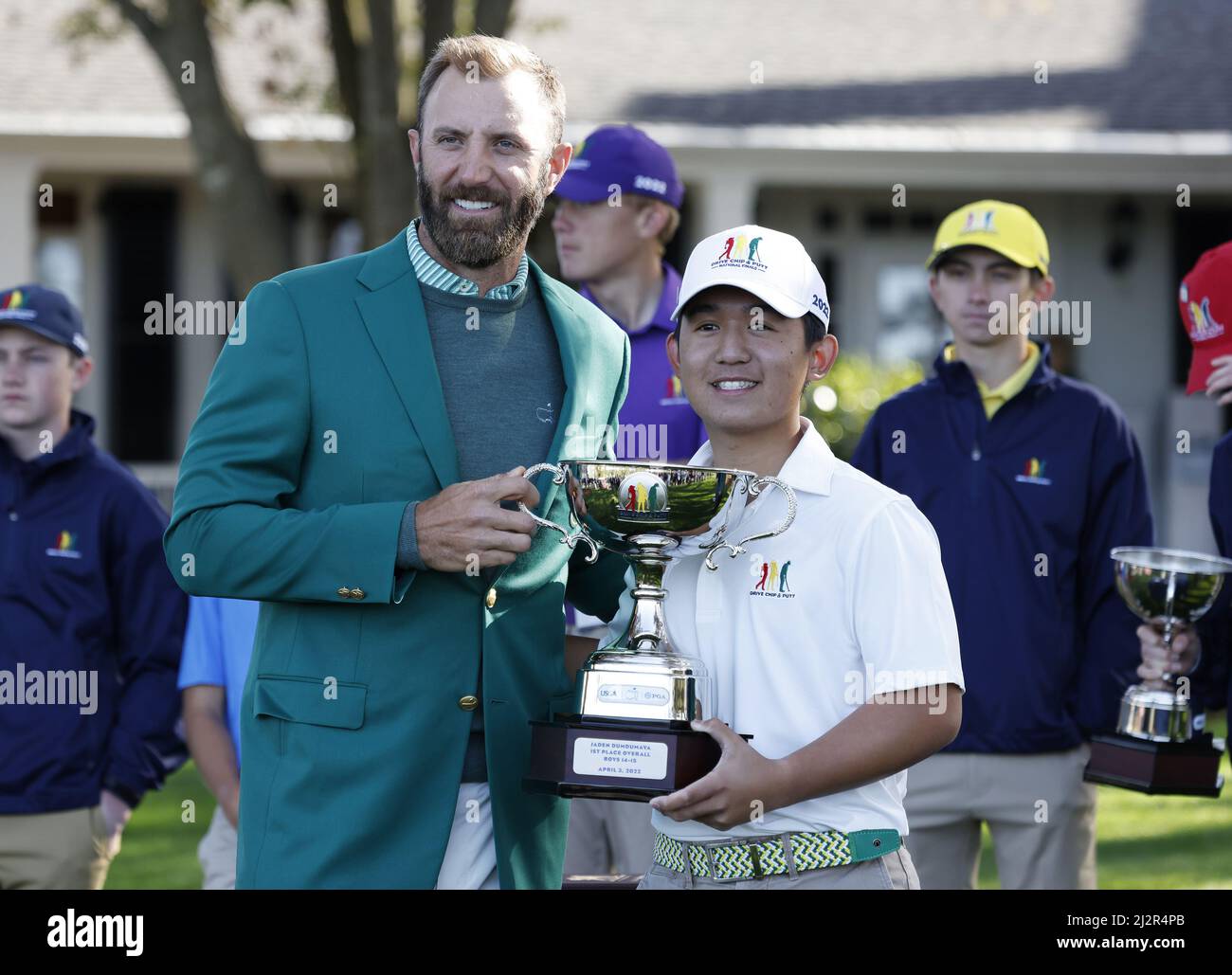 Augusta, United States. 03rd Apr, 2022. Dustin Johnson hands the trophy ...