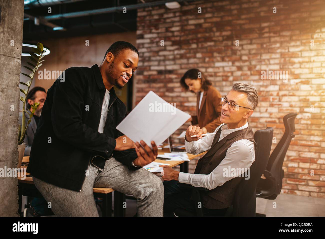 Group of business people have a meeting about company stats Stock Photo ...