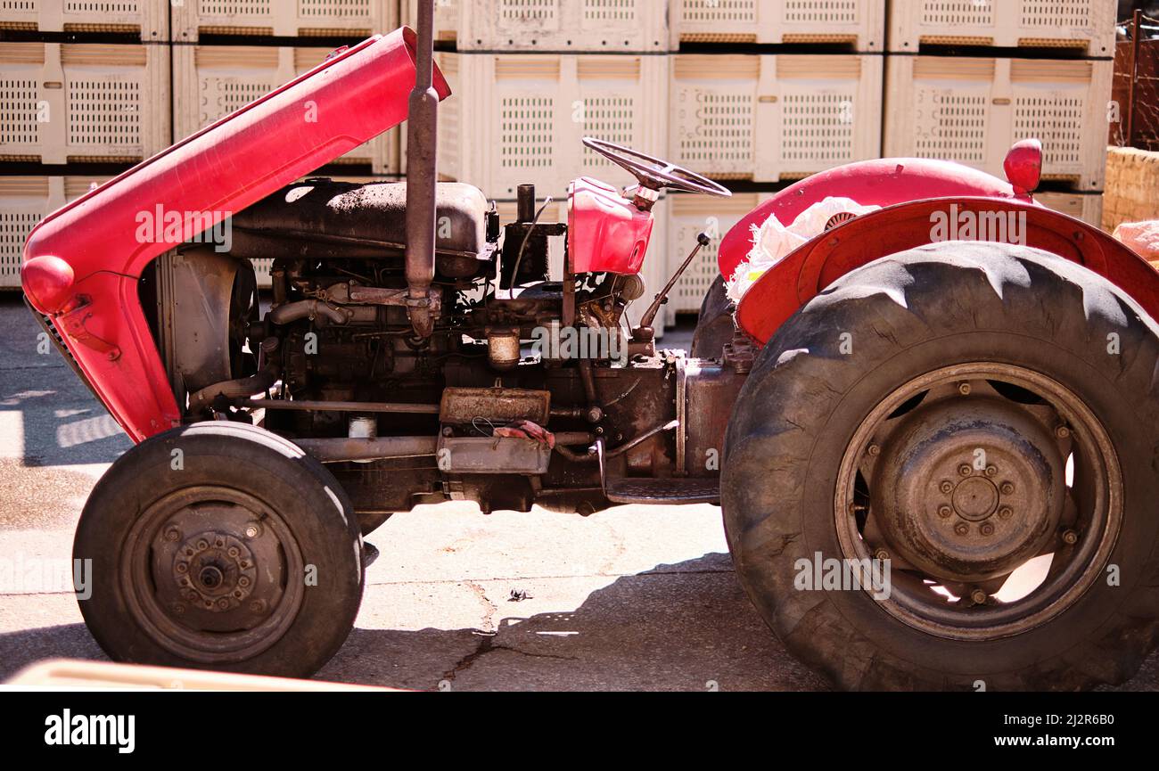 The vehicle that works as hard as you. Shot of a tractor parked at a ...