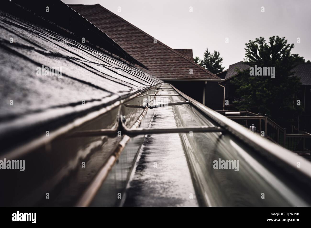 Selective focus on a section of residential guttering with hanger ...