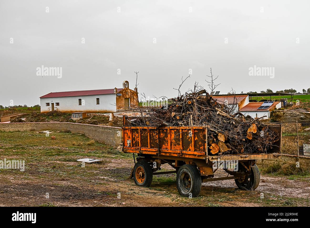 Old rusty trailer, full of firewood Stock Photo - Alamy