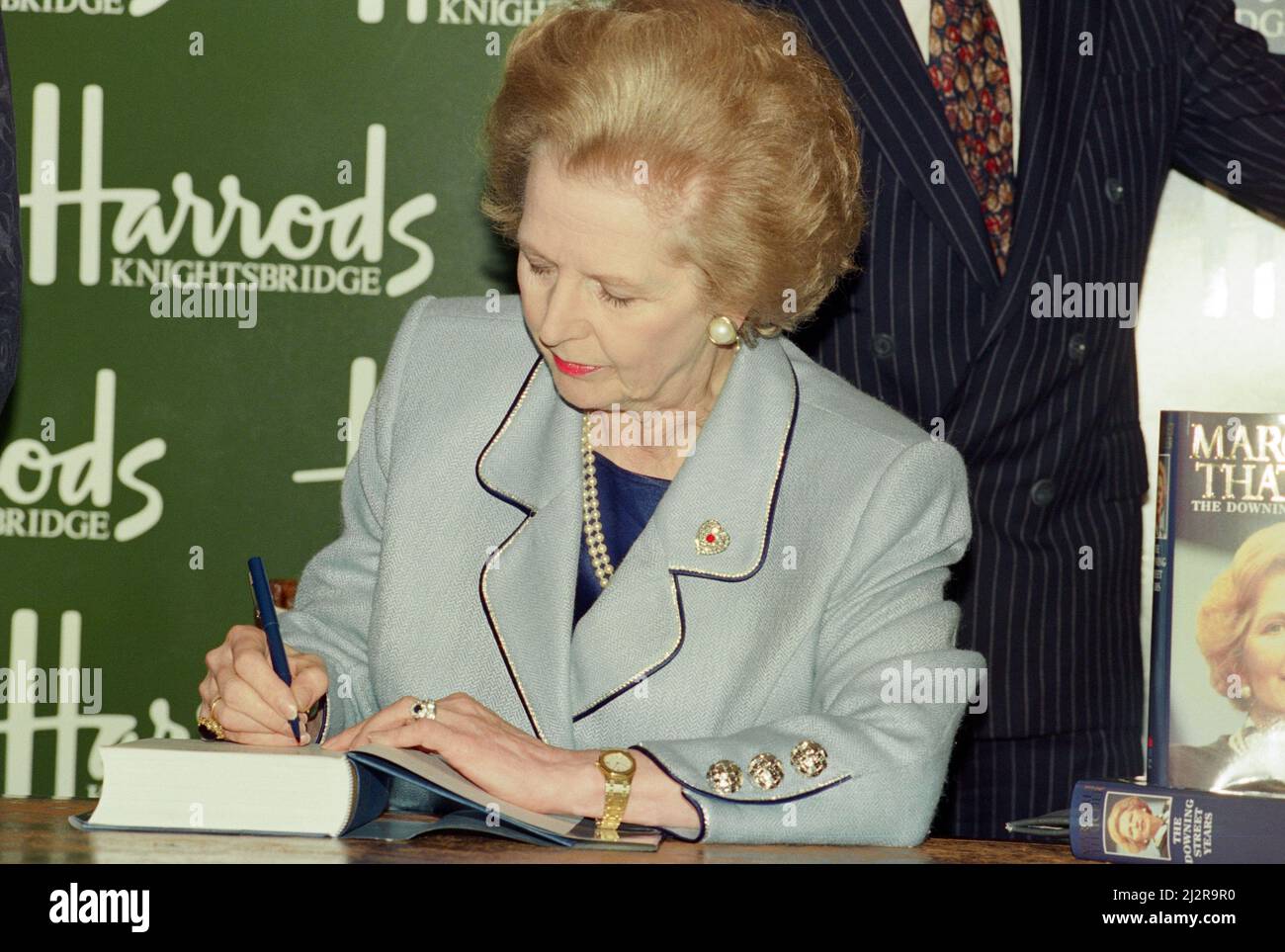 Margaret Thatcher in Harrods signing copies of her memoir "The Downing ...