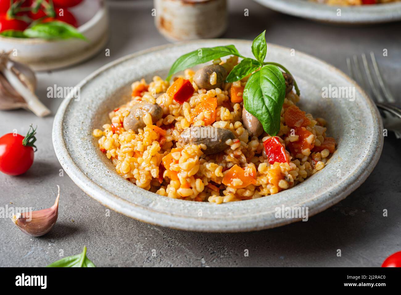 bulgur with chicken hearts and vegetables. Delicious healthy dish on a ...