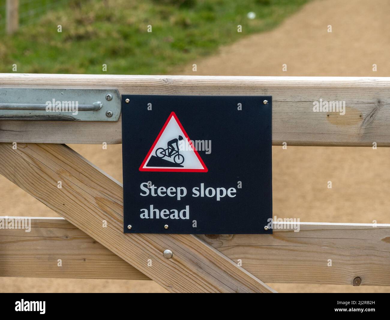 Warning sign for downward slope High Resolution Stock Photography and ...