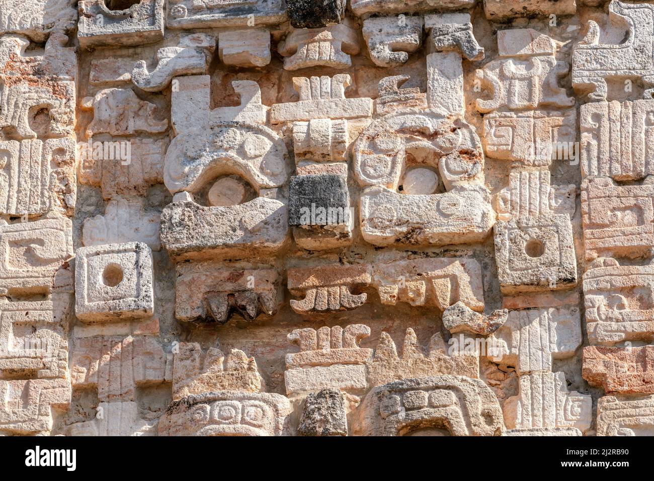 Mayan wall carvings at the mayan Nunnery Quadrangle ruins in Uxmal ...