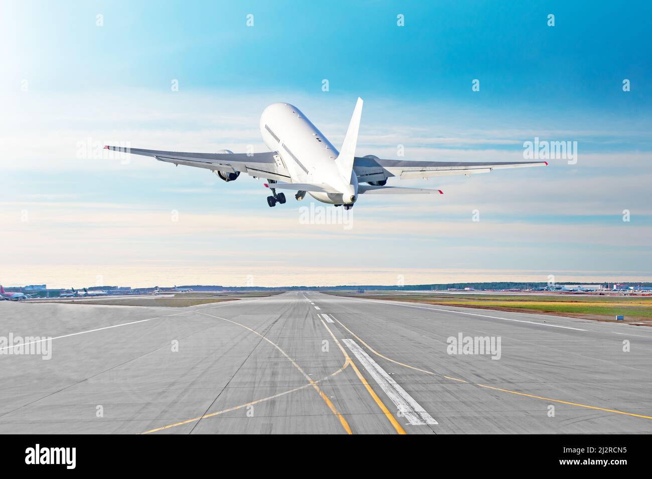 Airplane flying departure take off on a runway airport good weather ...