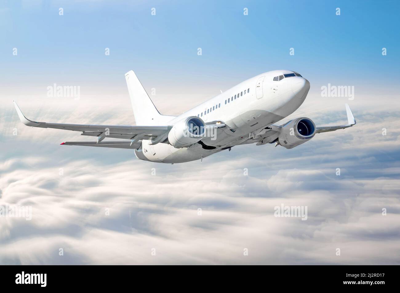 Airplane climb gains altitude at speed in motion blur above sky clouds ...
