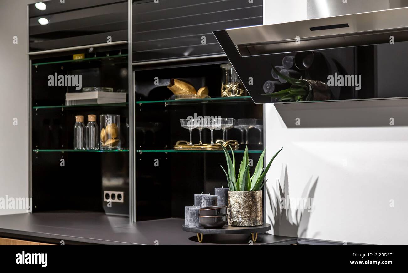 Part of a modern kitchen, a place for cooking, extractor and stove ...