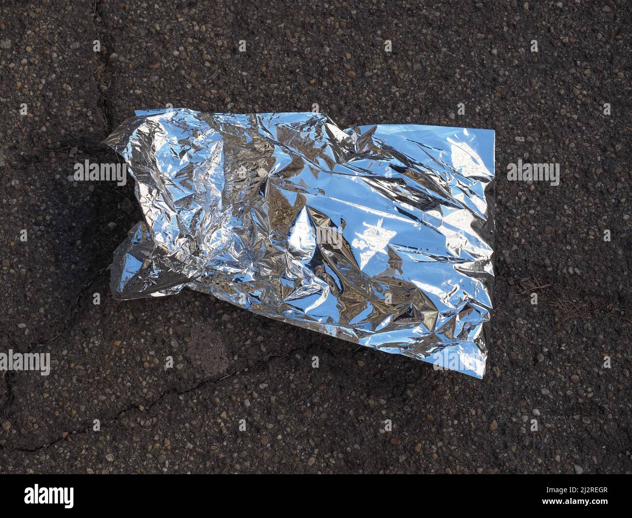 reflective aluminium foil bag on dark background Stock Photo - Alamy