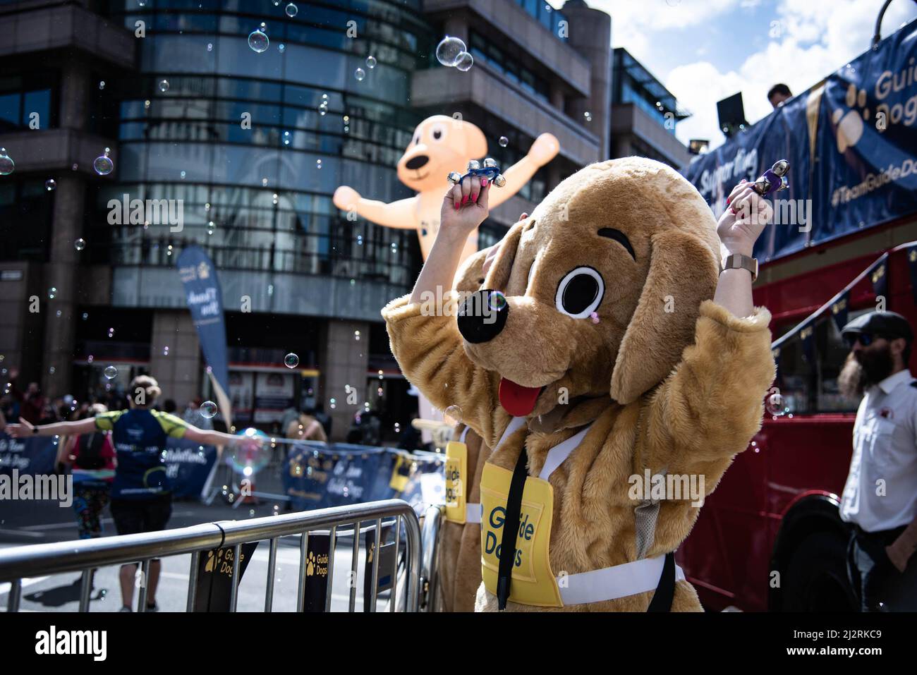 London, UK. 03rd Apr, 2022. A Guide Dog cheers on the participants ...