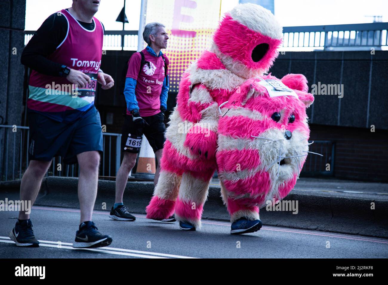 London, UK. 03rd Apr, 2022. A participant dressed in a pink cat costume ...