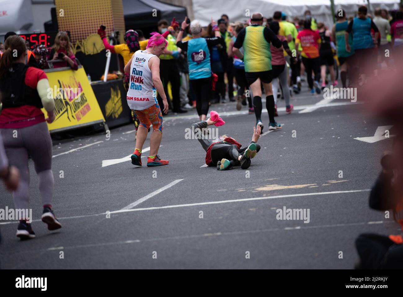 London, UK. 03rd Apr, 2022. A runner falls down on the ground while ...