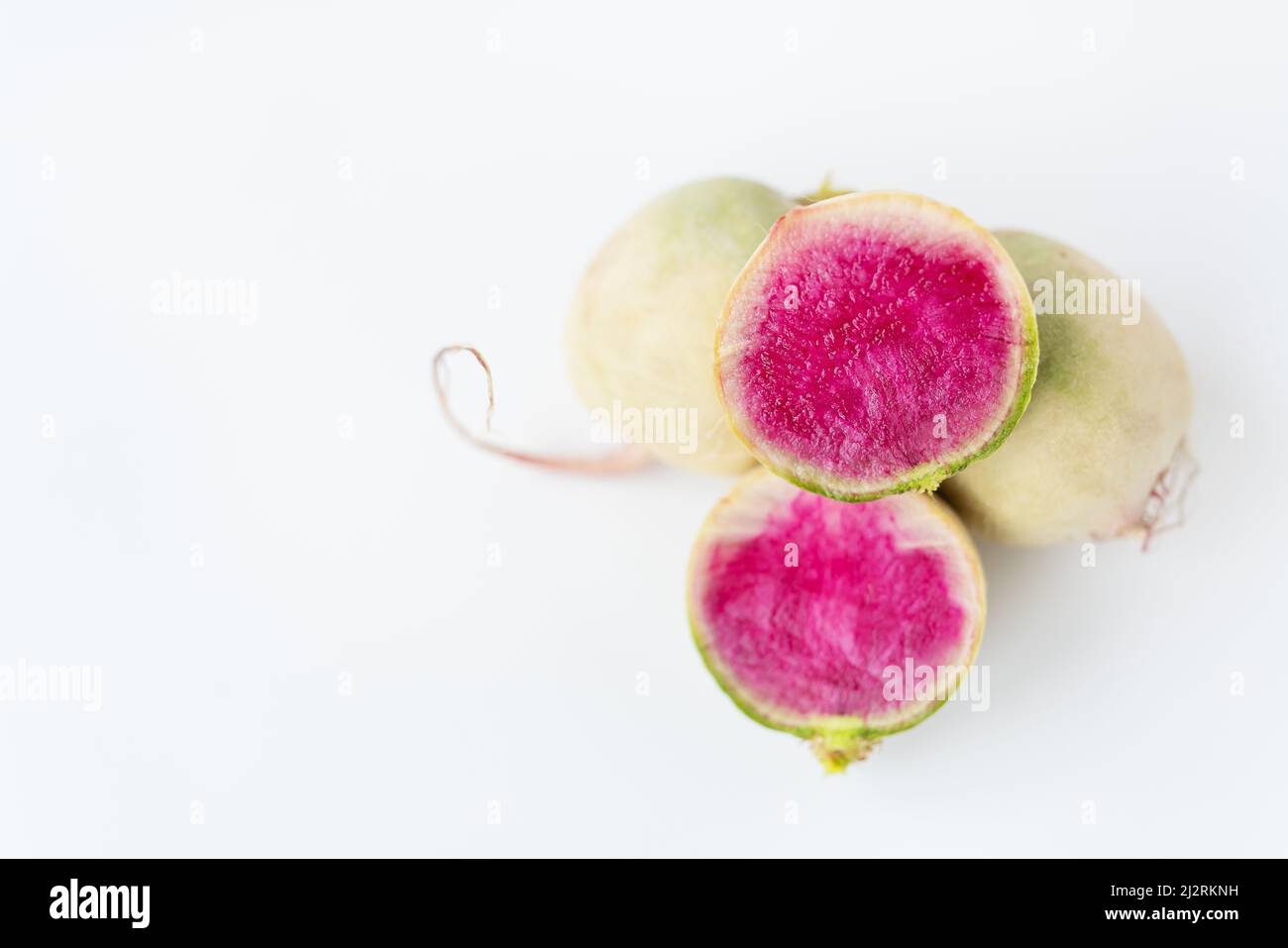 Delicious pink radish in the cut of the dragon's eye variety on a white ...