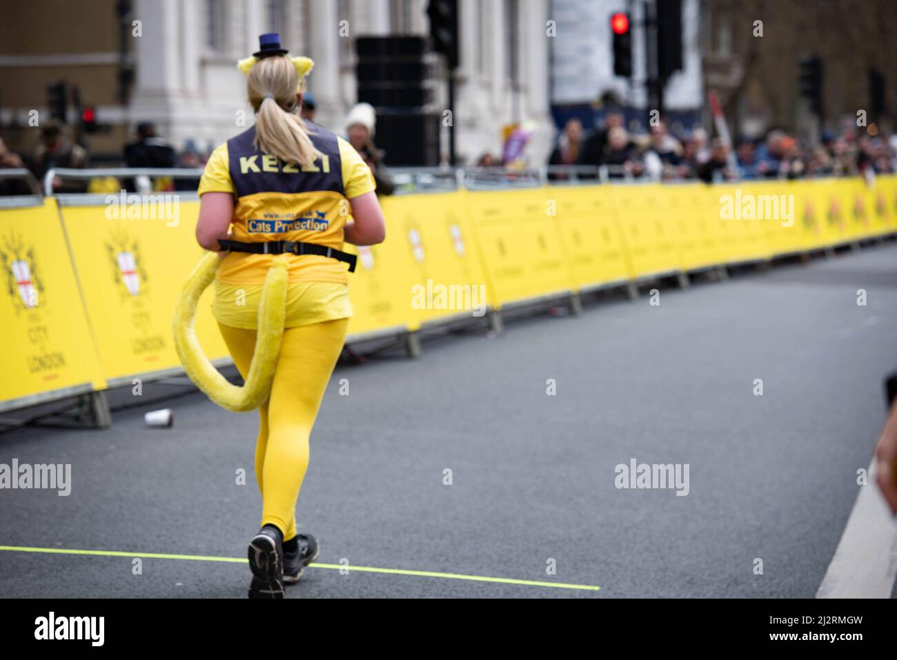 London, UK. 03rd Apr, 2022. A runner dressed with a cat tail approaches ...