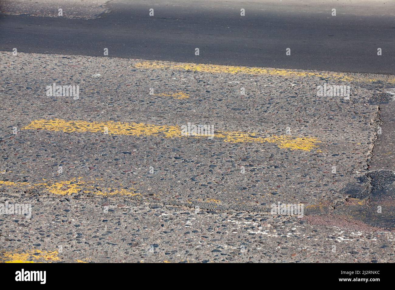 old road markings on a motorway, part of an asphalt road with road ...