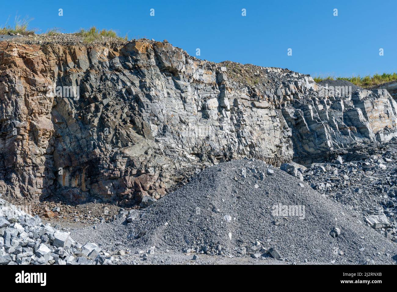 Rock being excavated at a quarry to industrial use in the building of ...