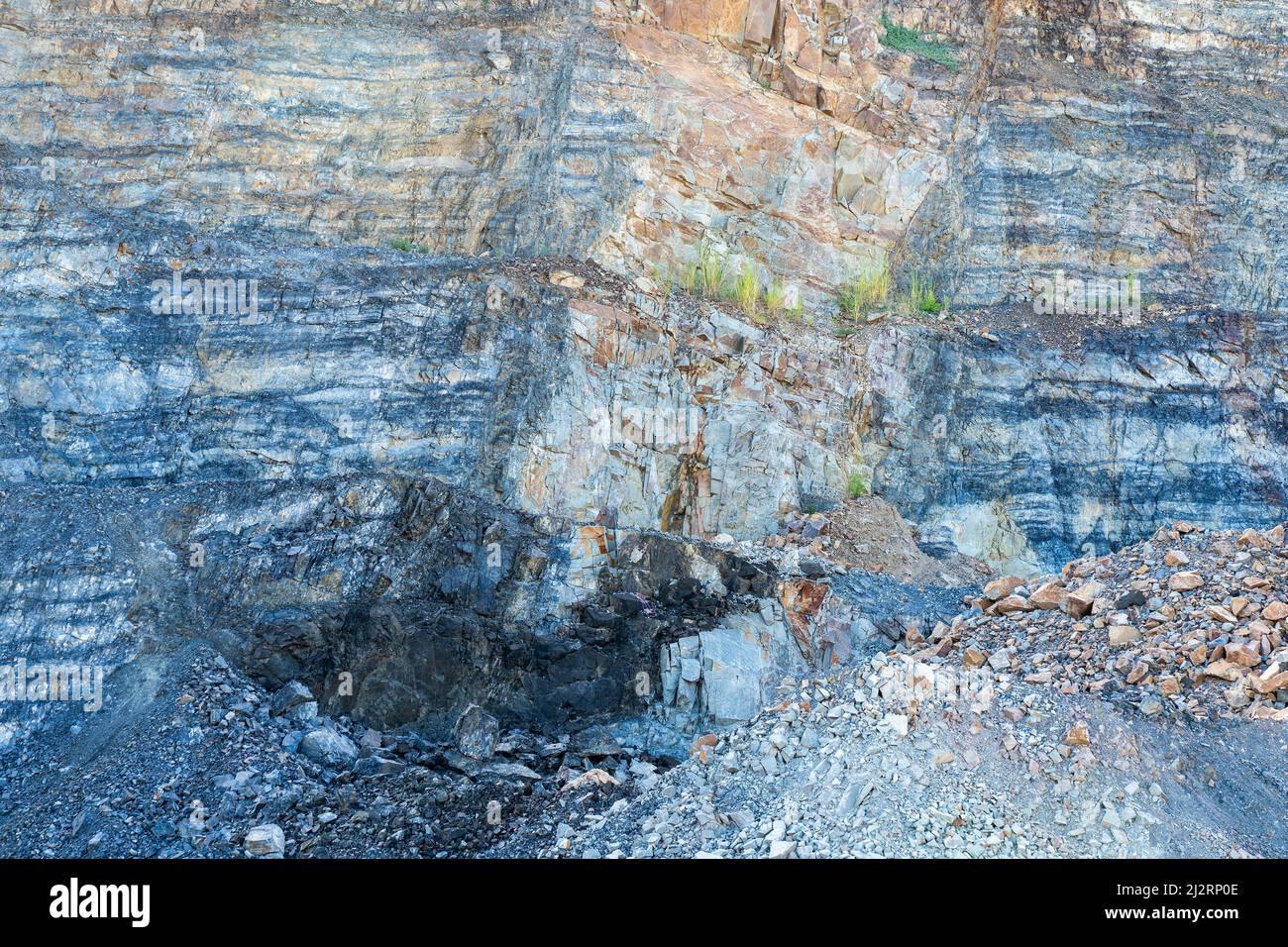 Rock being excavated at a quarry to industrial use in the building of ...