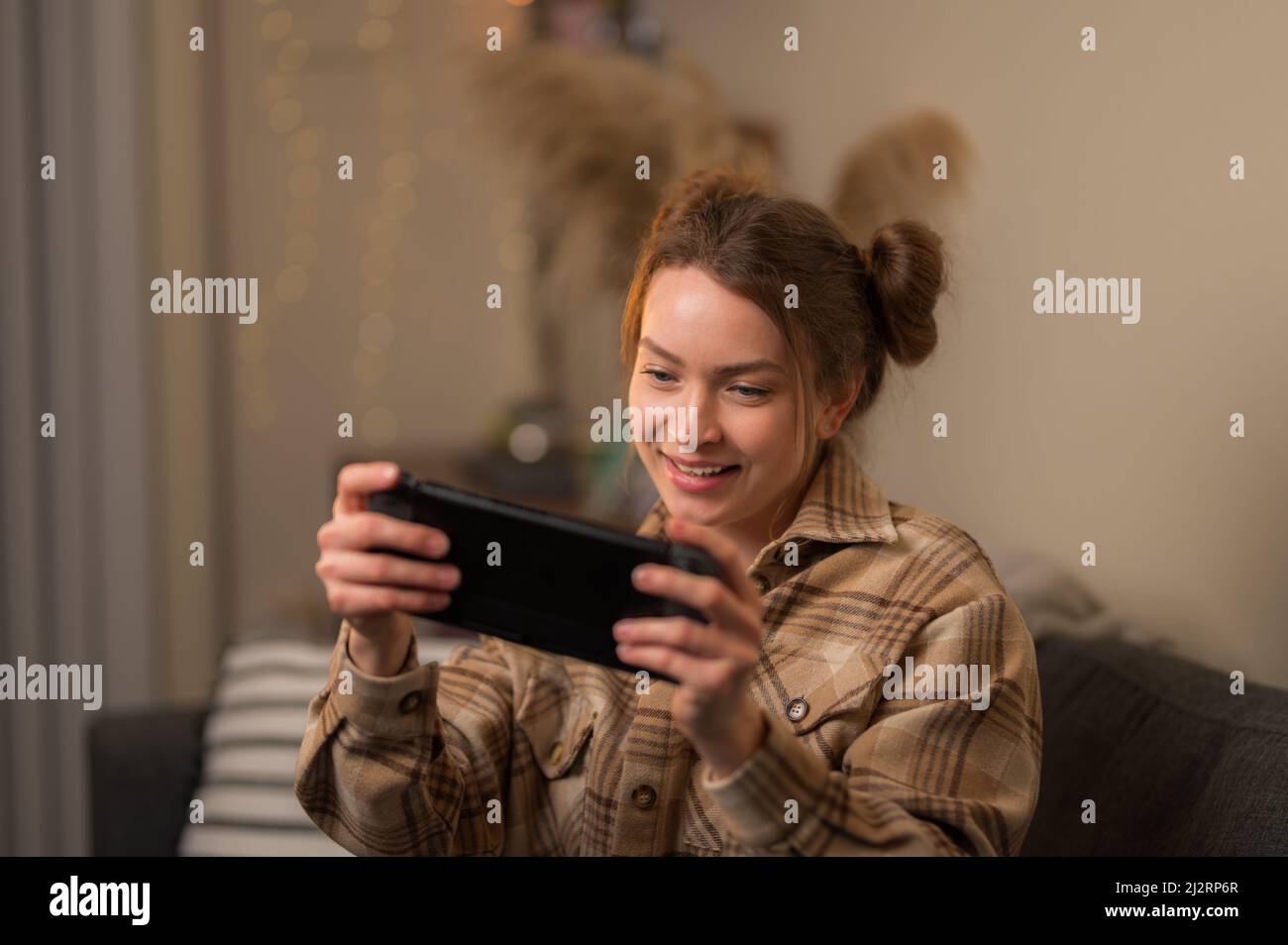 Girl gamer with a portable game console. Video games, computer games ...