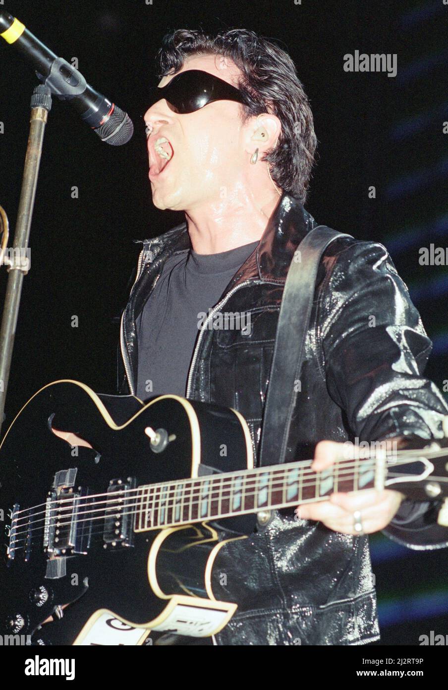 U2 in concert on the Zoo TV Tour, Wembley Stadium. Bono performing on ...