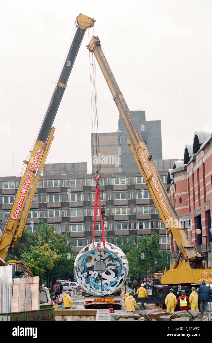 The sculpture 'Bottle of Notes' is lifted off its low loader in the ...