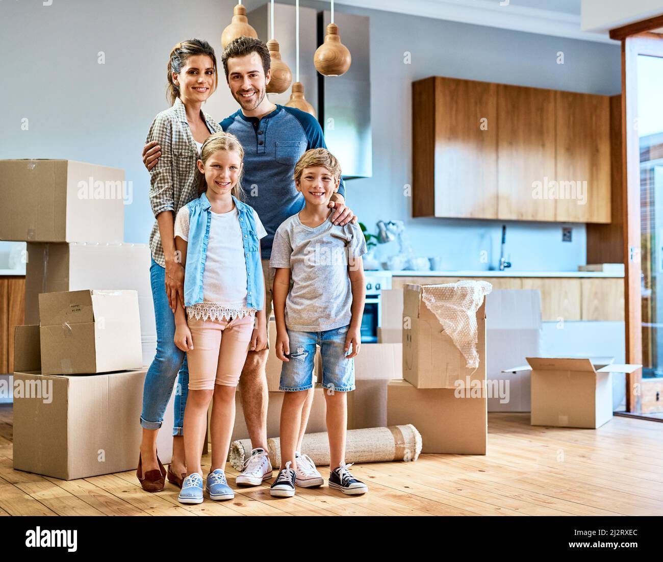 Our family is one strong unit. Portrait of a cheerful young family ...