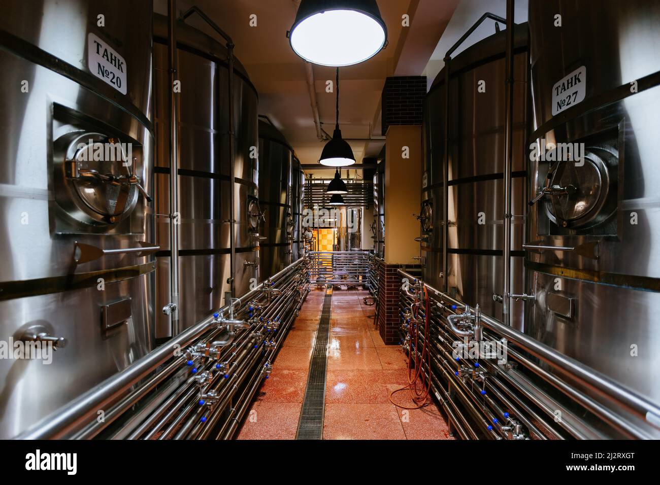Vats for fermentation. Craft beer production line in modern brewery ...