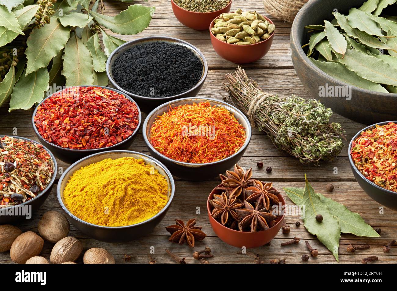 Bowls of various aromatic spices and herbs. Different seasoning - red ...