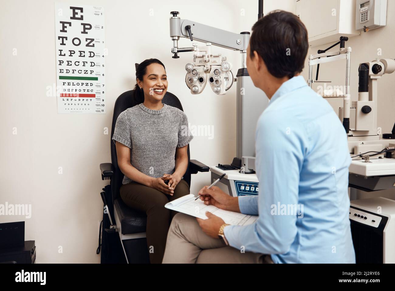Is this the first eye test youve had. Shot of a young woman having an ...