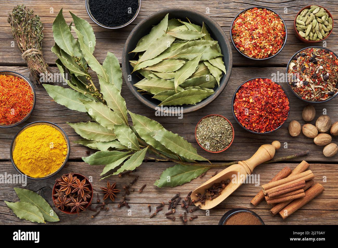 Bowls of various spices - red hot pepper, paprika, anise, saffron ...