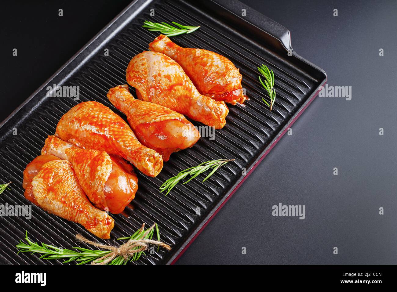 Convenience food, precooked.Raw Marinated chicken meat legs with spices ...