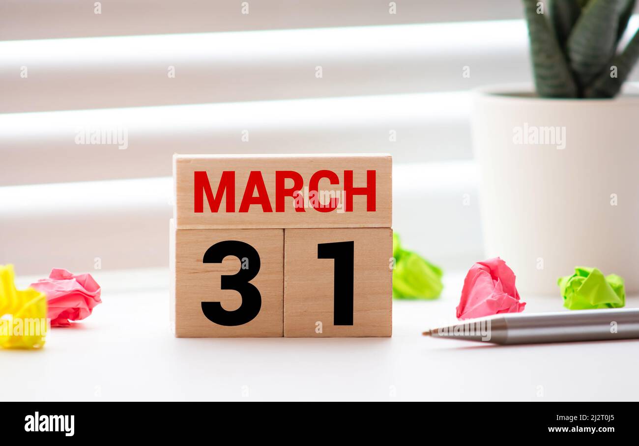 MARCH 31st. Image of MARCH 31 wooden color calendar on white wood wall ...