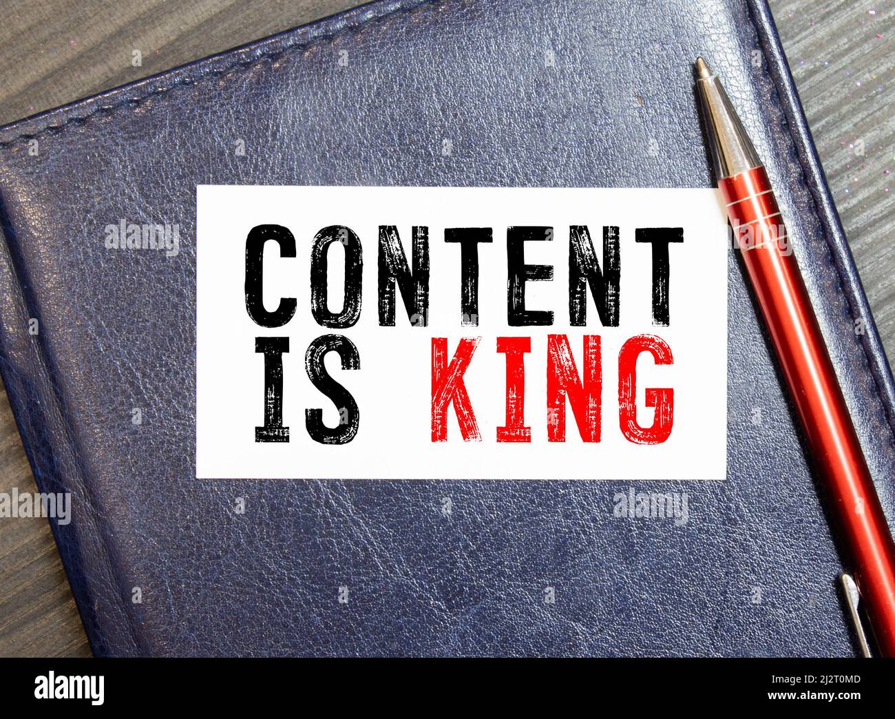 CONTENT IS KING message on the card shown by a man Stock Photo - Alamy