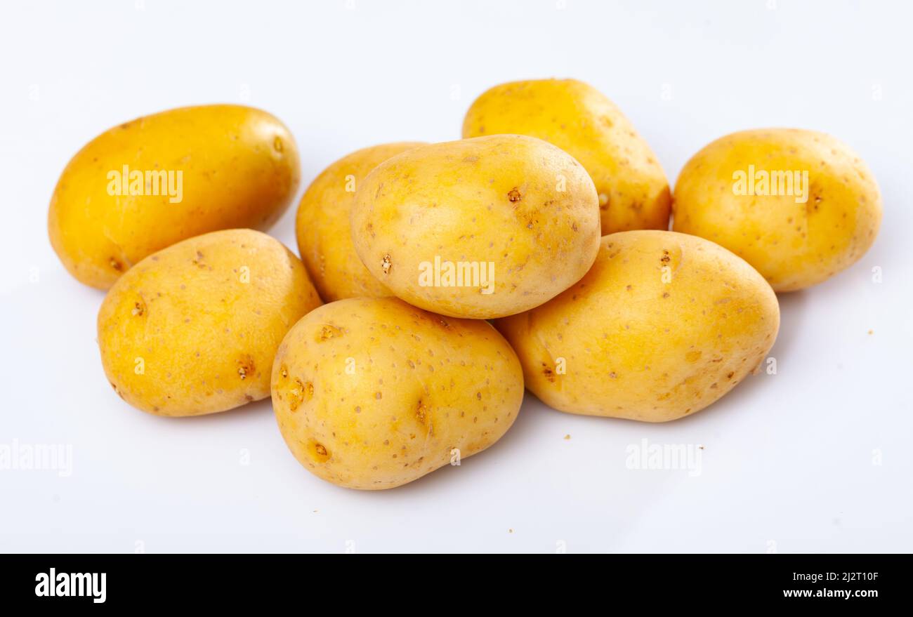 Freshly washed potatoes on a white background Stock Photo - Alamy