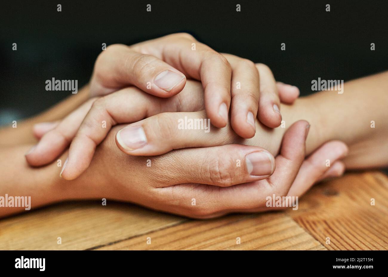 Be there for those who need you. Cropped shot of two people holding ...