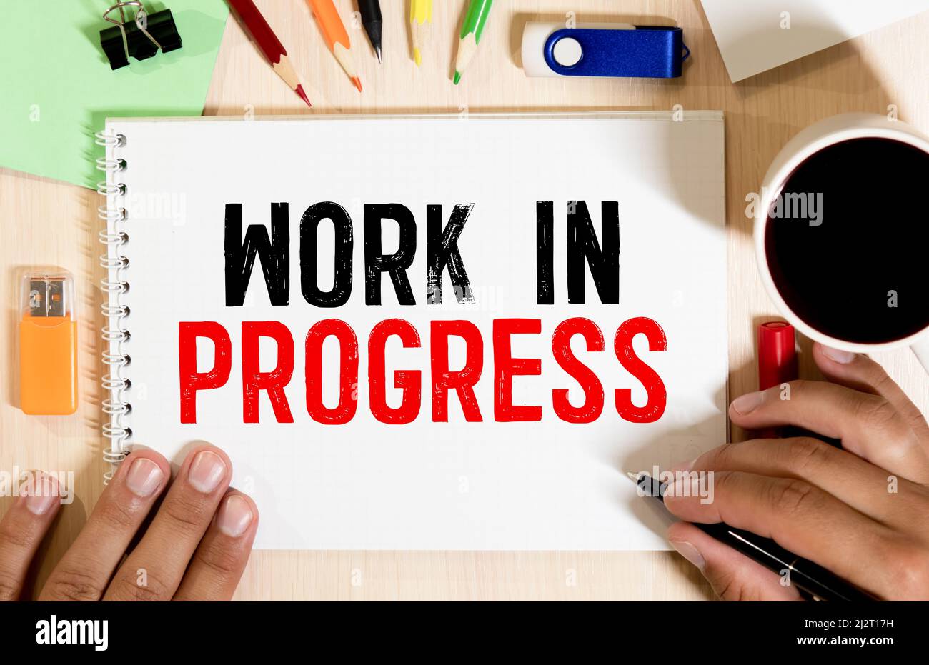 Work in Progress text written on a notebook with pencils Stock Photo ...