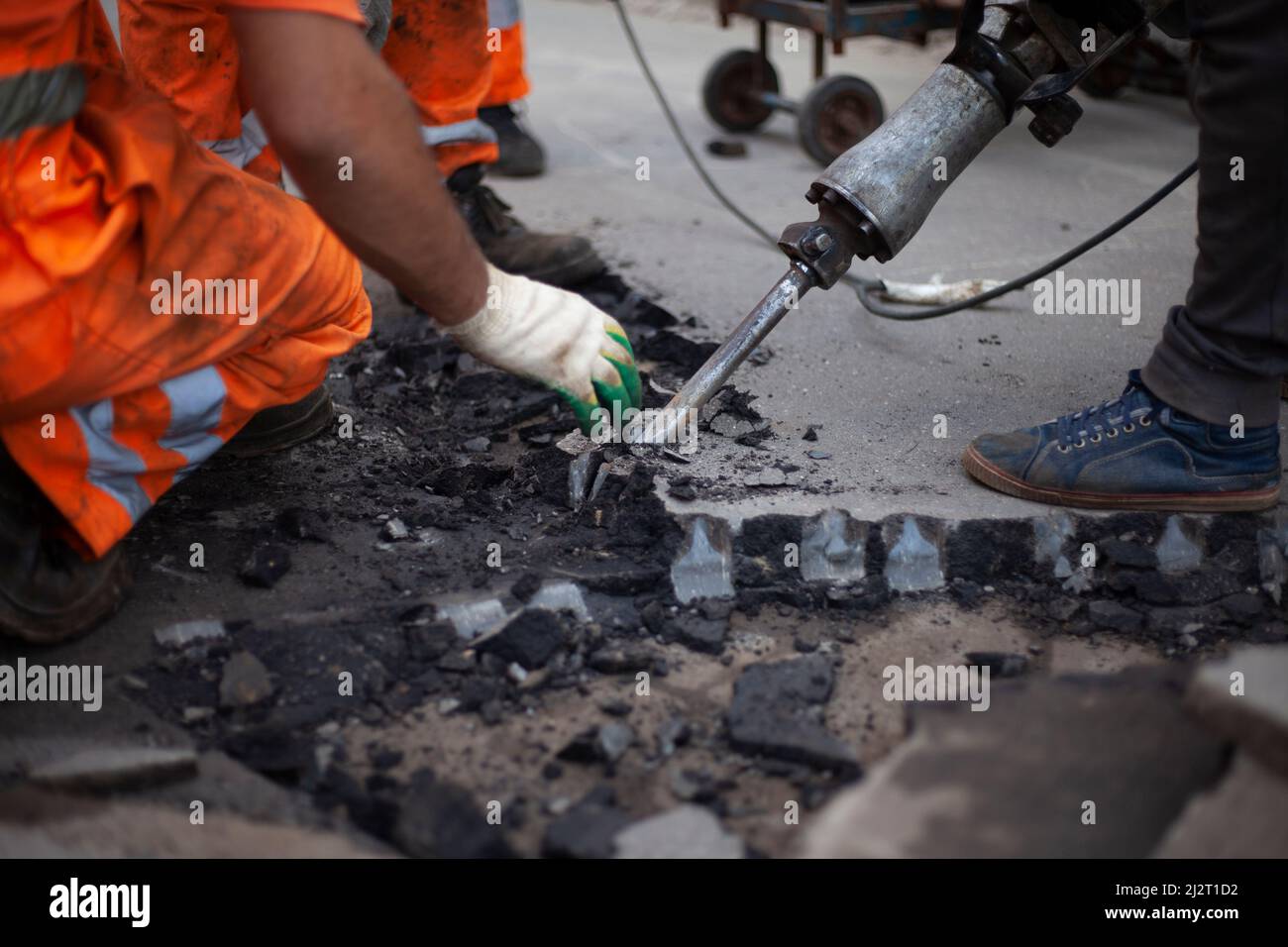 Road repair. Installation of curbs on the highway. The workers are ...