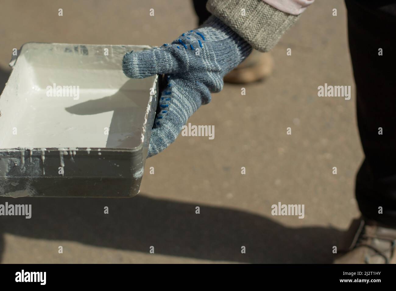 Paint for the street. Painting the object. Marking the road. Work with ...