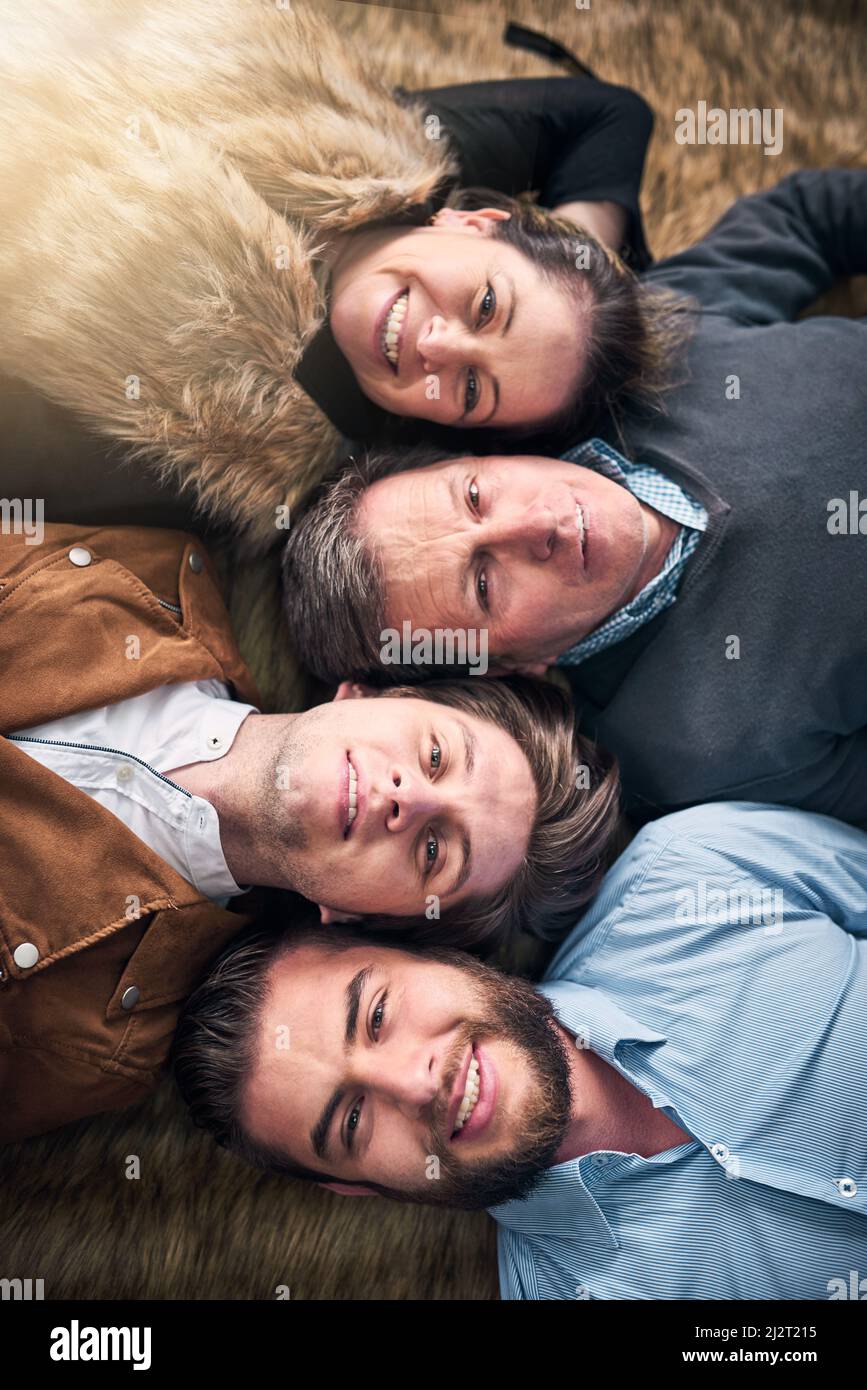 Life is about family. High angle shot of a family at home Stock Photo ...