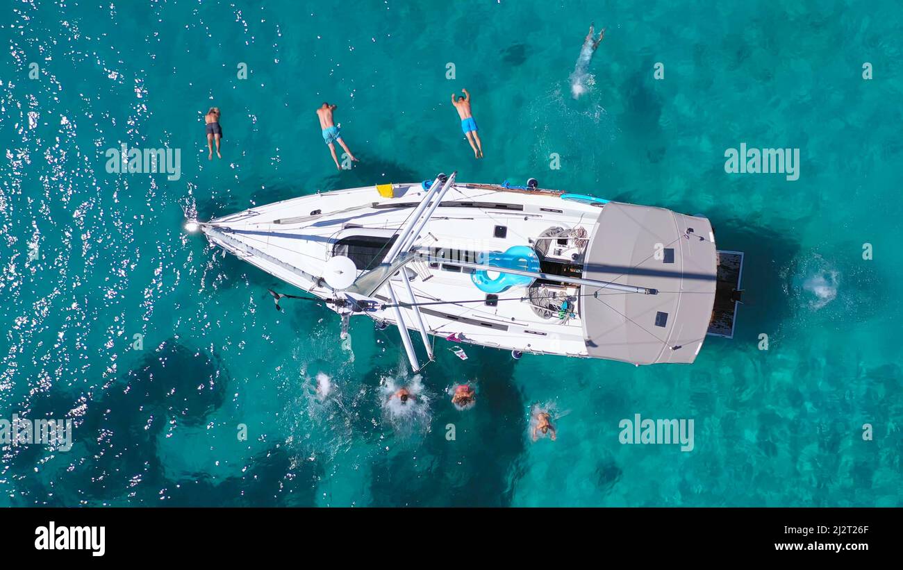 Top view of young friends jumping from sailboat. Yachting. Sail boat ...